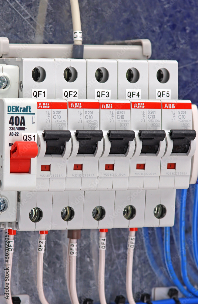 electric circuit breakers installed on a din rail in an electric ...