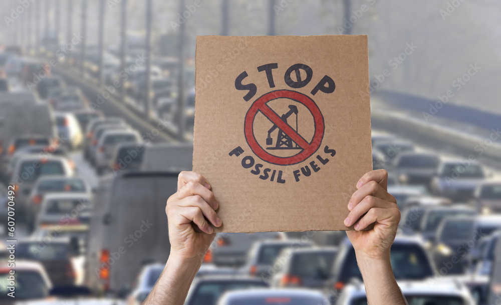 Stop fossil fuels poster over traffic jam background. CO2 emissions ...