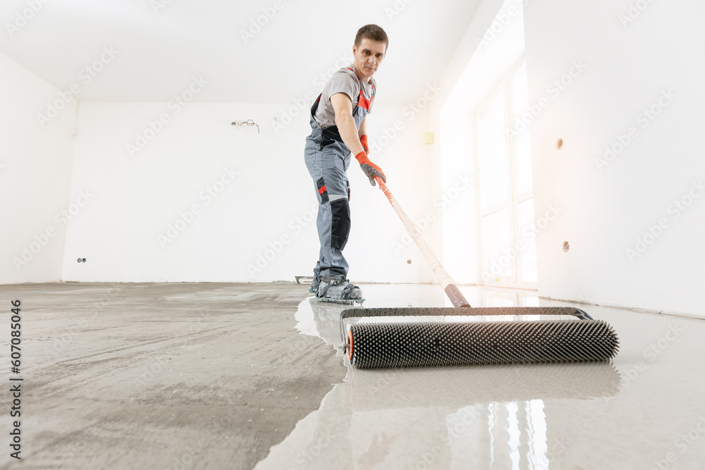 Master with needle roller for new screed concrete with mixture of ...