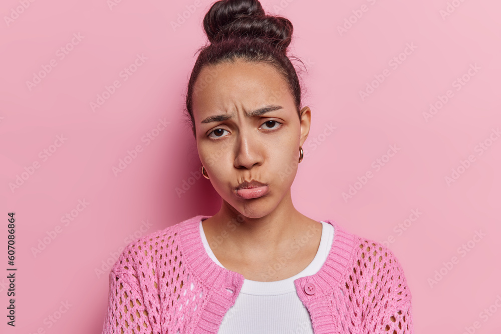 Offended sad woman purses lips being hurt by bad words has sulking ...