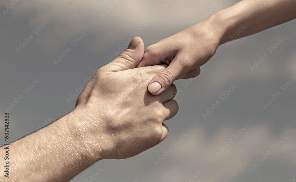 Lending a helping hand. Hands of man and woman reaching to each other ...