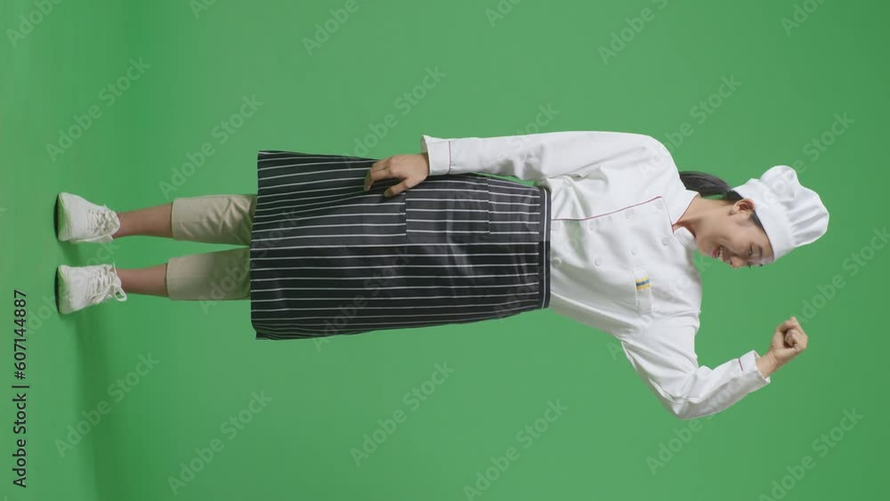 Full Body Of Asian Woman Chef Smiling And Flexing Her Bicep While ...