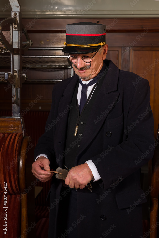 Vintage train conductor punching ticket Stock Photo | Adobe Stock
