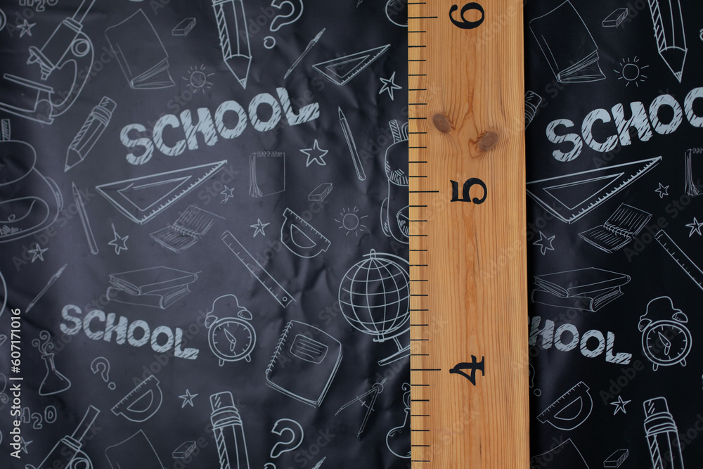School Blackboard and ruler in classroom, closeup. Back to school hand ...