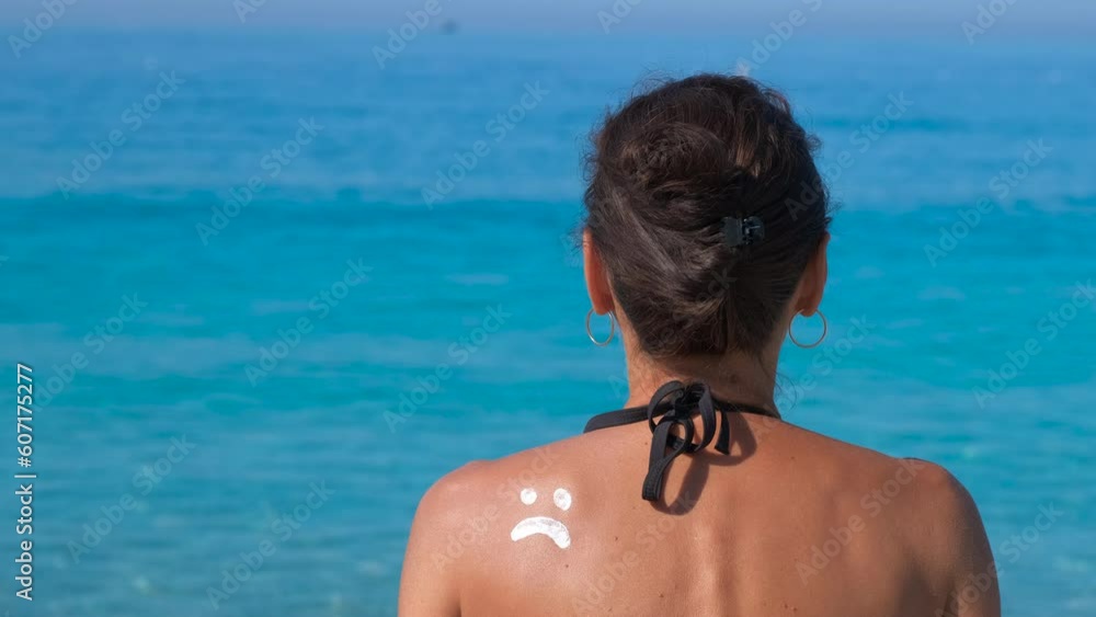 Caring skin with protection lotion on bay. A woman try to takes care ...