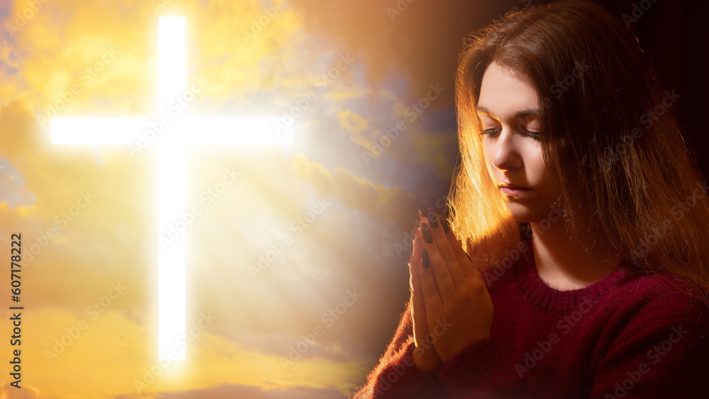 Christian girl. Woman praying with palms clasped. Christian cross in ...