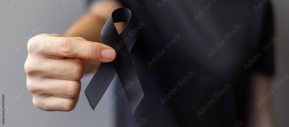 Woman holding black Ribbon for Melanoma and skin cancer, Vaccine injury ...