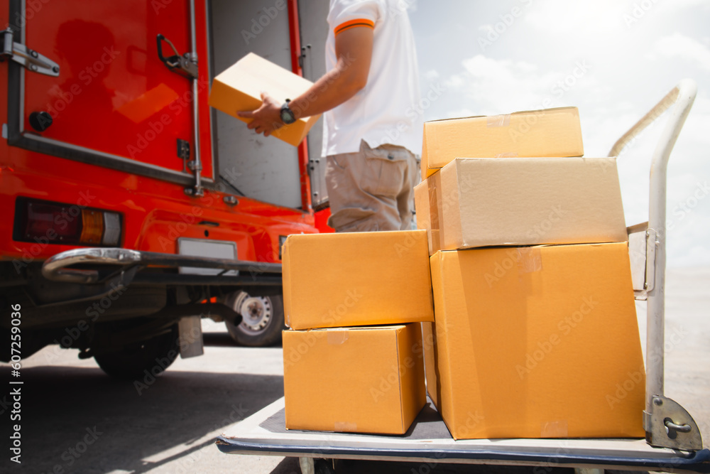 Parcel Boxes on The Cart. Delivery Man Carrying Package Boxes. Worker ...