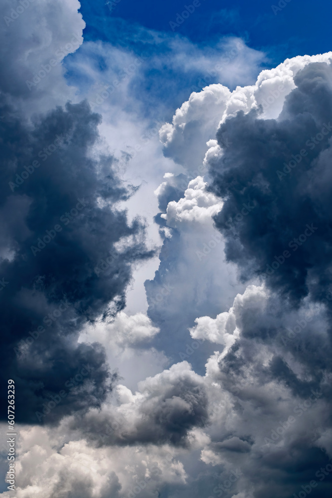 Dramatic vertical sky background with dark and bright clouds for roll ...