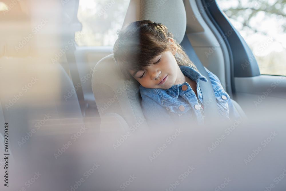 Girl sleeping in back seat of car Stock Photo | Adobe Stock
