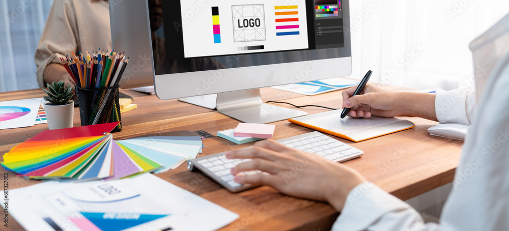 Photo Graphic designer work on computer laptop and with graphic drawing ...