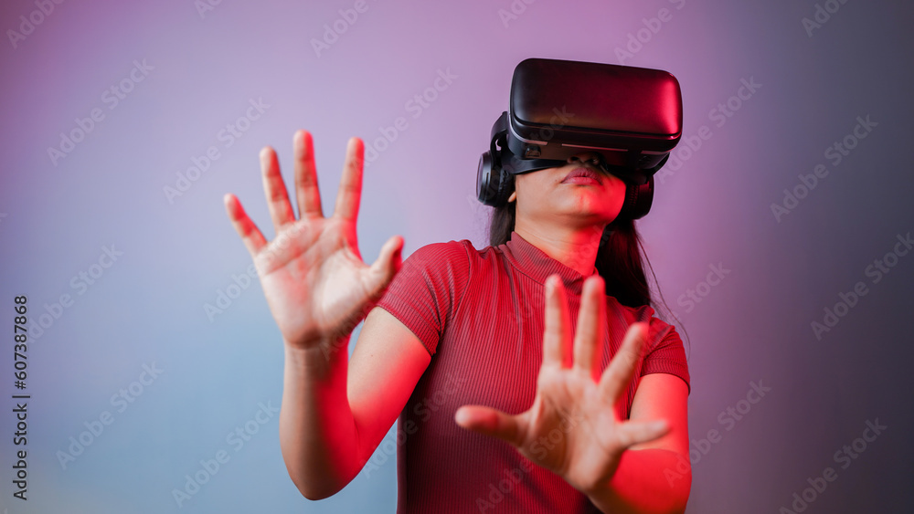 Young Asian Indian woman scared, wearing virtual reality headset, a ...