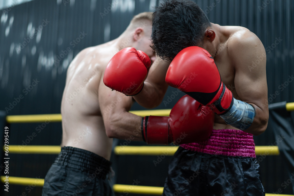 Two male athlete boxing competition in ring. Diverse ethnic men punch ...