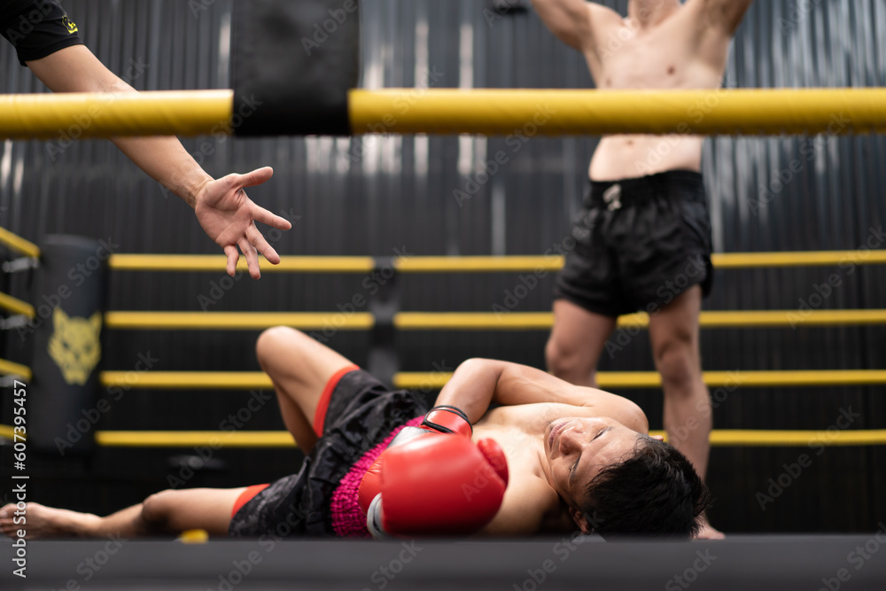 Unconscious Asian boxer lay on floor referee counting down knockout in ...