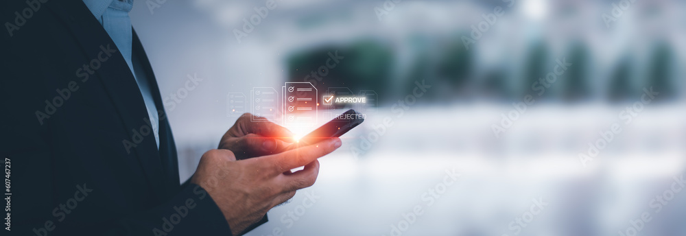 Businessman using mobile smartphone to approve certificate document ...
