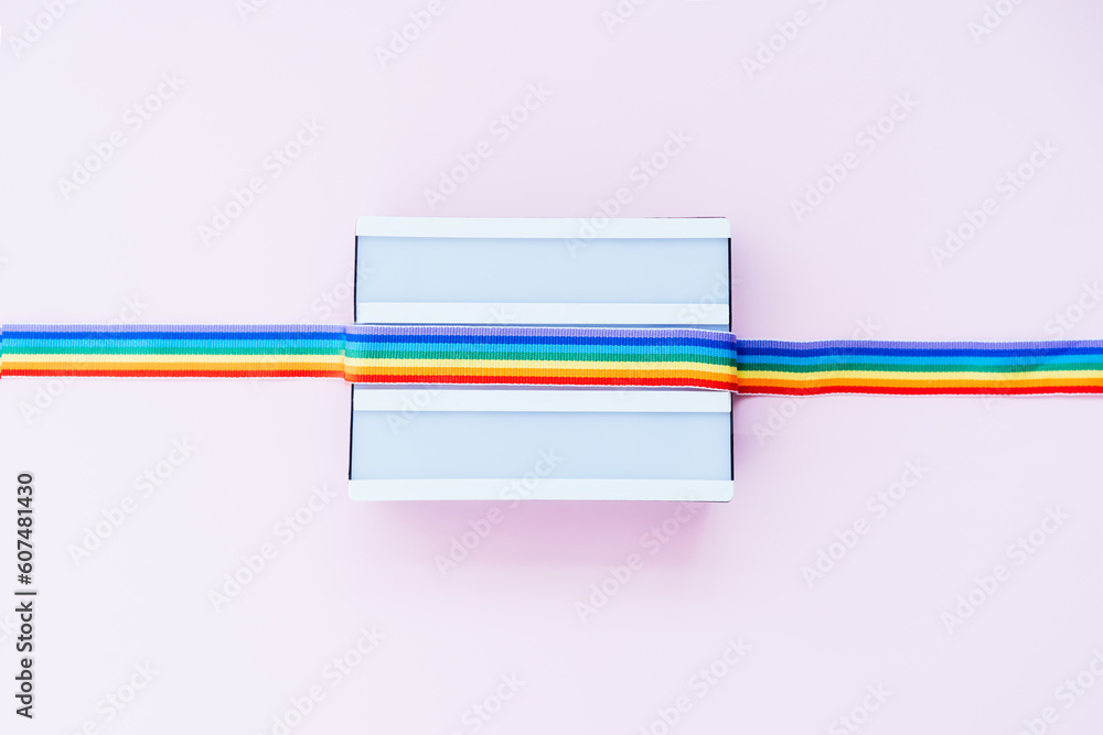 Top view white light box mockup with rainbow LGBT ribbon on a light ...