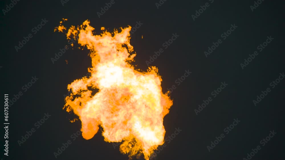 Ignited Gas Stream. A powerful pillar of bright flame with swirling ...