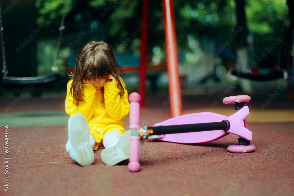 Little Girl Falling from a Scooter Feeling Upset and Cry. Unhappy child ...