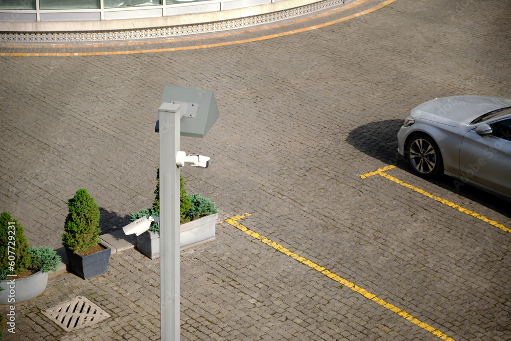 Top view surveillance camera in an open parking lot near a hotel. Stock ...