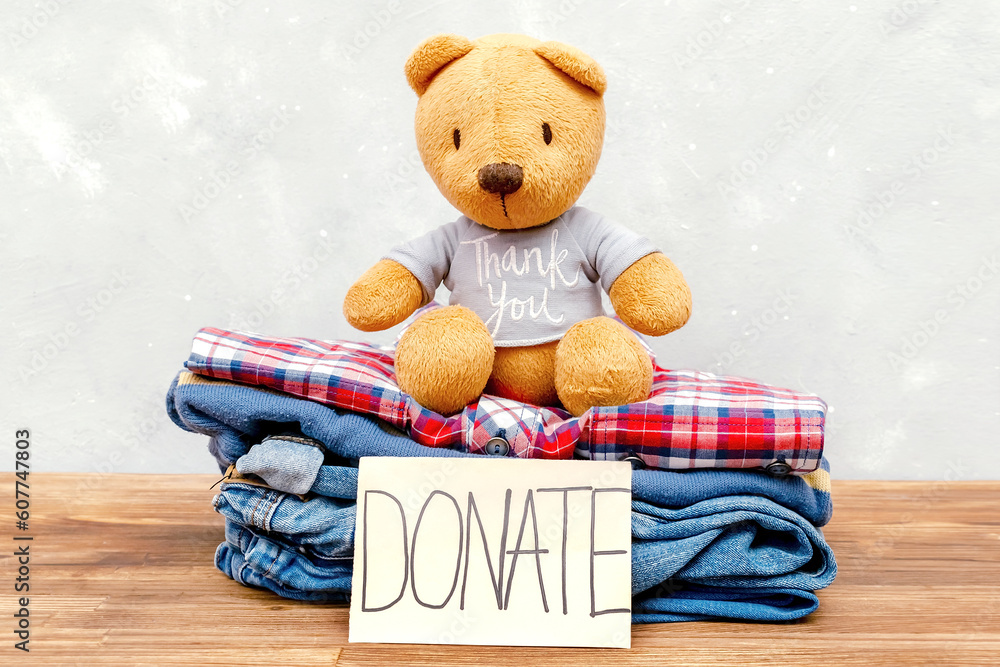 Old baby children clothes,teddy bear toy.Donation, volunteering help ...