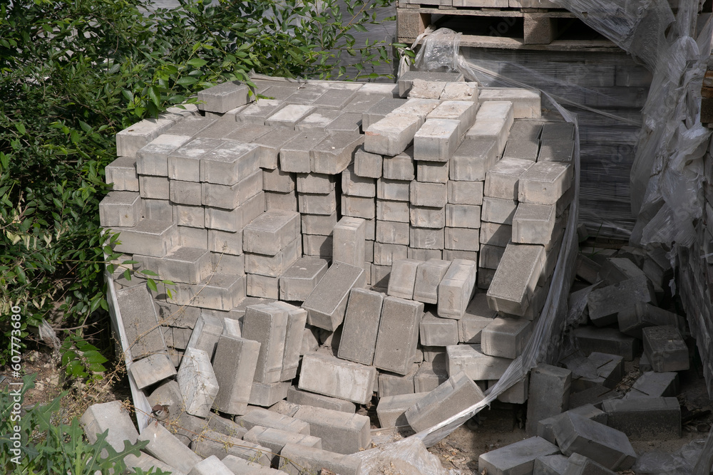 Old square paving slabs laid out in vertical rows. Processing of ...