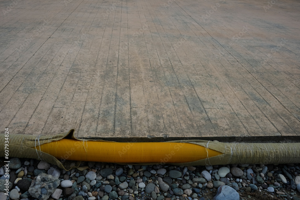 Power cable in PVC pipe. yellow plastic pipe for Electrical wire ...