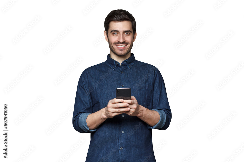 Smiling modern man standing, holding his phone with both hands Stock ...