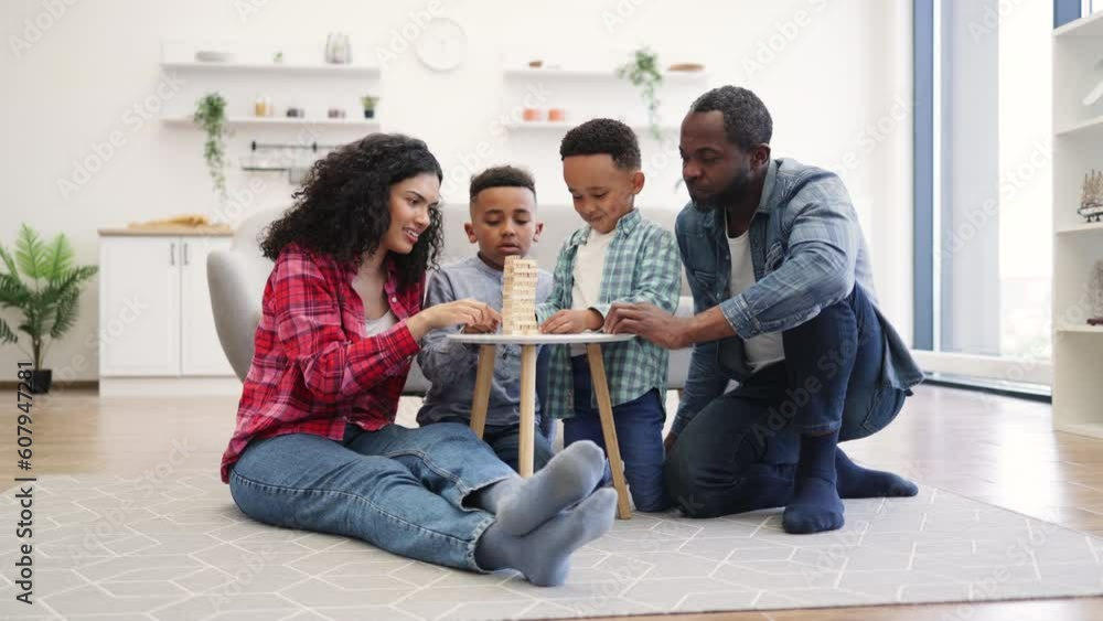 Friendly multiethnic family gathering together around coffee table on ...