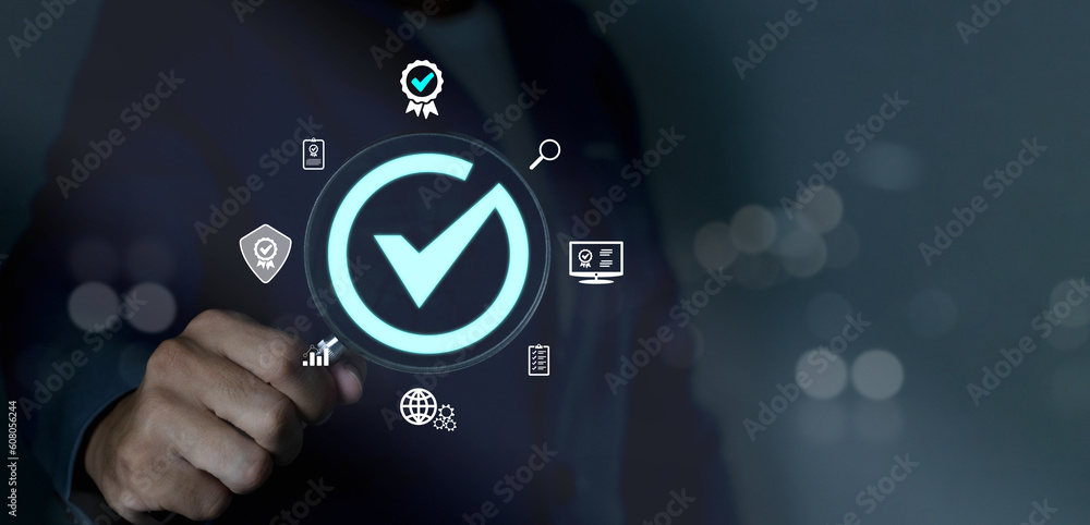 Quality control businessman holding magnifying glass with virtual ...