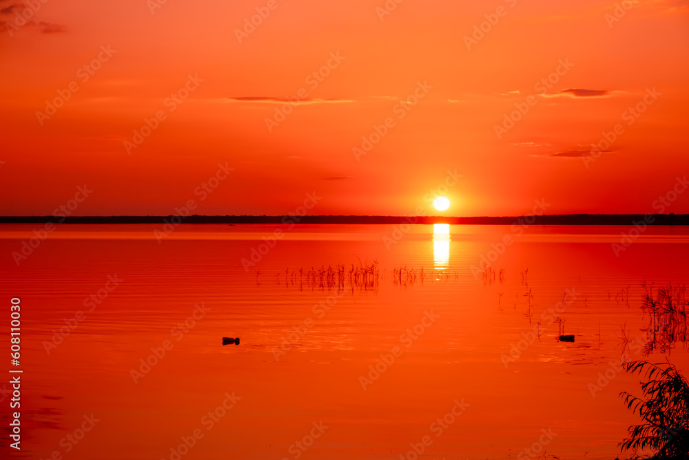 Beautiful red sunset above the lake. Sun path. Seascape. Calm water ...