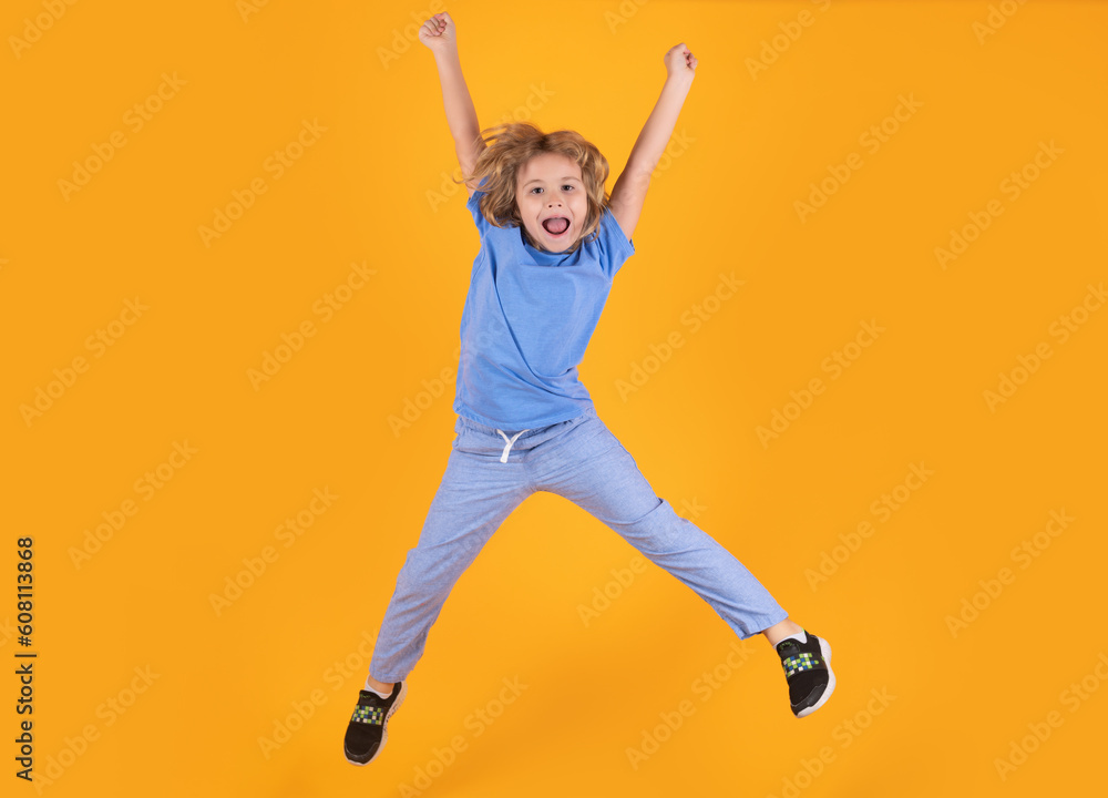 Full length of excited kid jumping. Full length body size of carefree ...