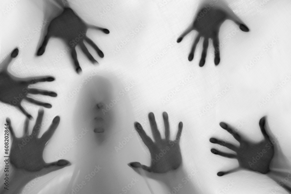 eerie blurry hands and face of people as if they have been trapped ...