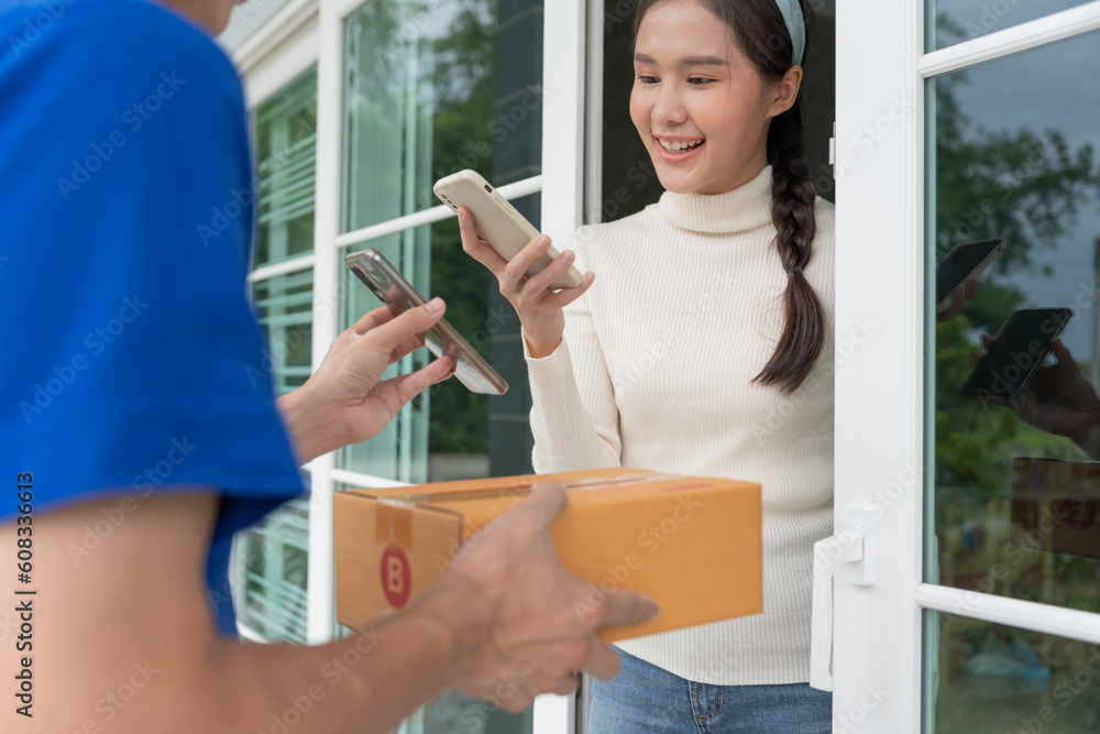 Happy smile Asian woman scan QR code for pay of food. Delivery man send ...