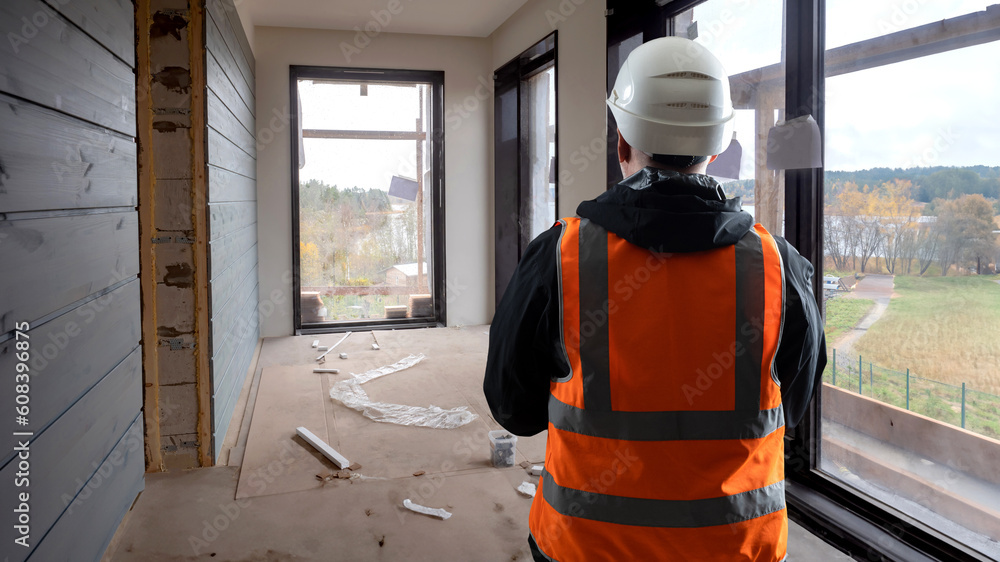 Construction works. Man foreman with back to camera. Construction ...