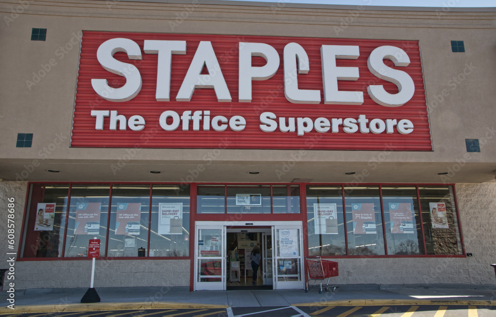 Staples retail store entrance and windows signs people inside Stock ...