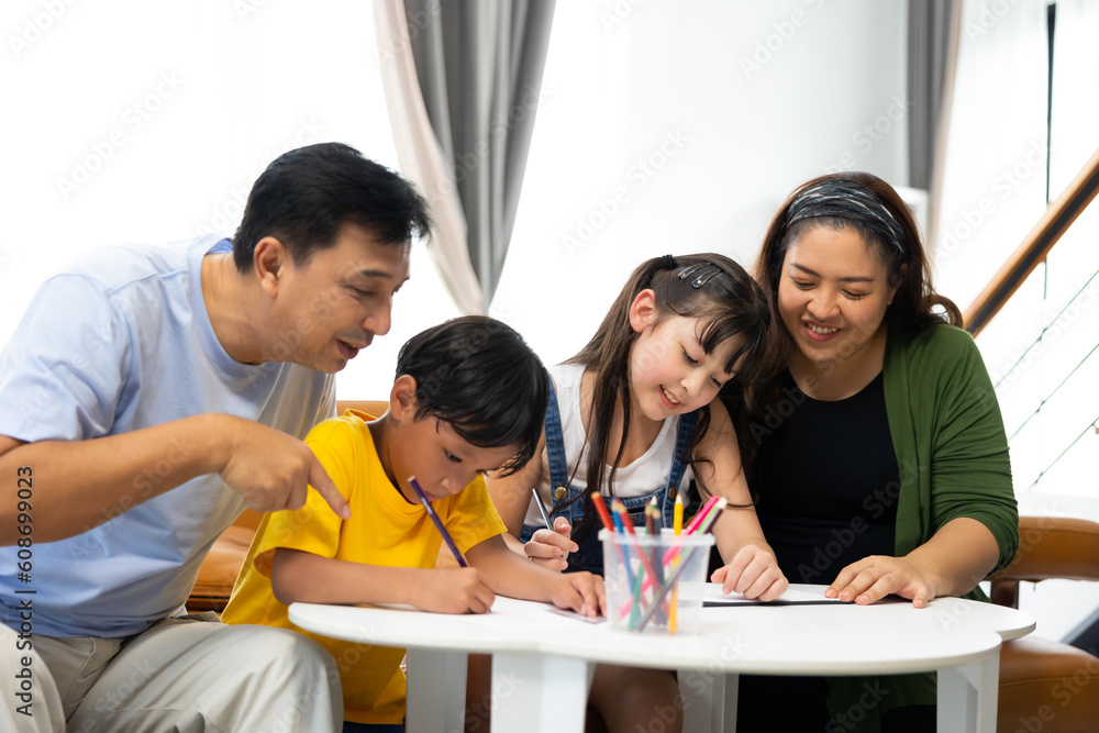 Family drawing a colorful pictures together at home. Happy children ...