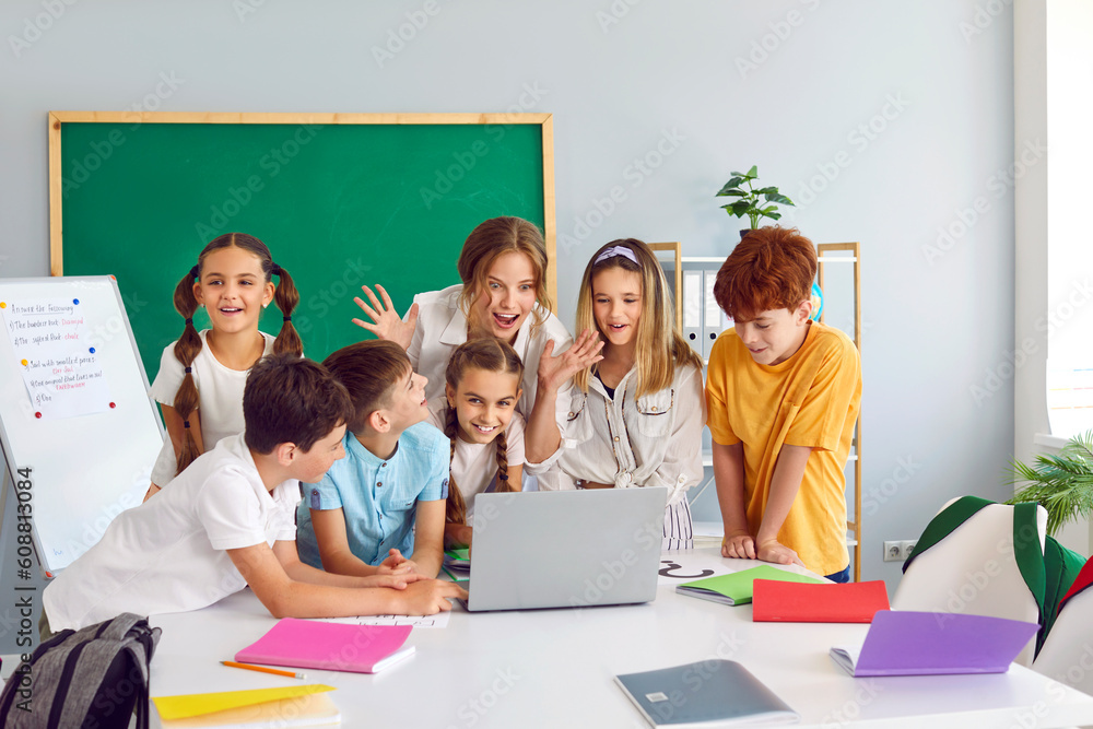 Small group of happy positive excited smart school children have class ...