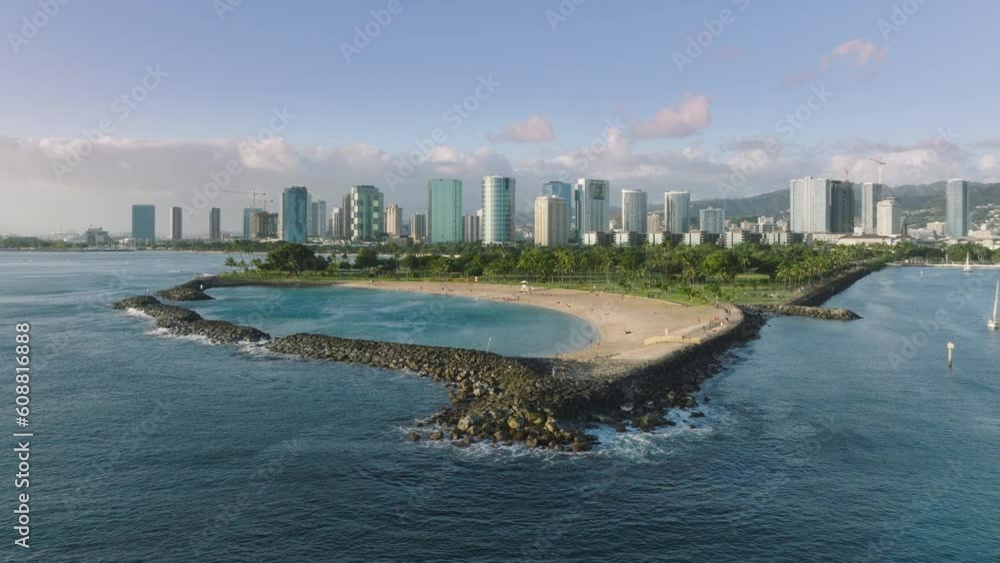 Scenic view above green Magic island beach park with Honolulu cityscape ...