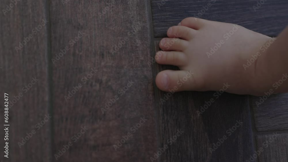 little baby barefoot legs heels toes wooden floor tiptoes learn stand ...