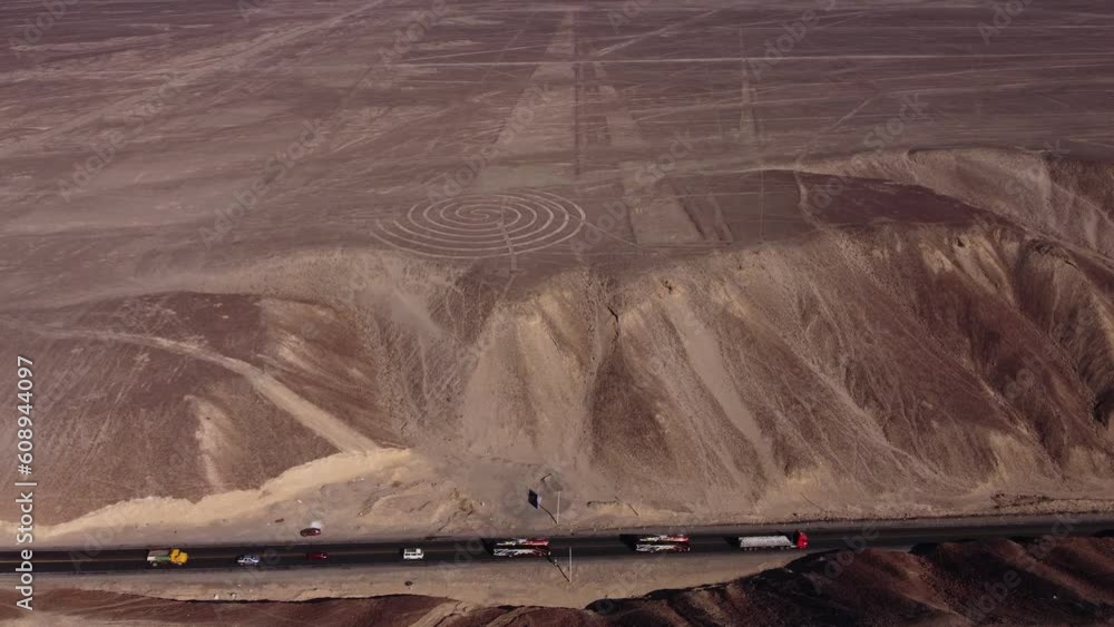 Aerial video of the Nazca Lines. Drone flies forward above the desert ...