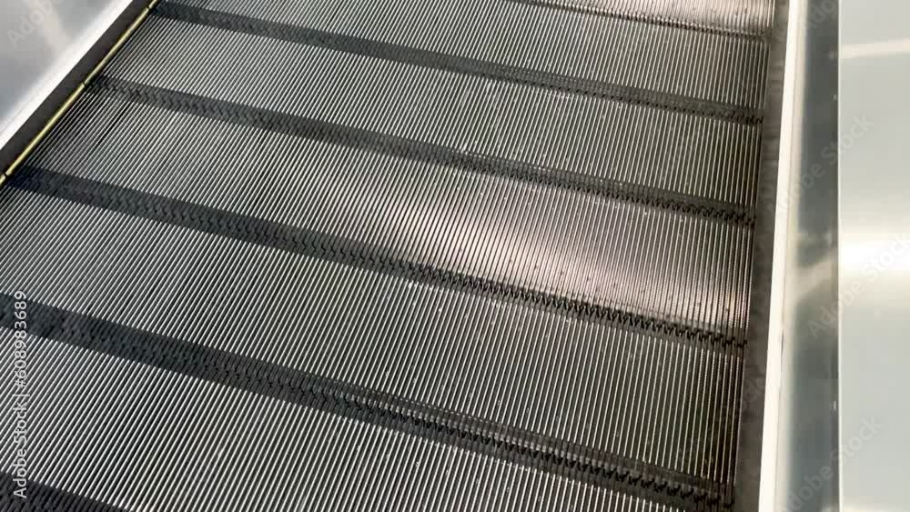 Flat escalator - moving walkway travelator in underground train station ...