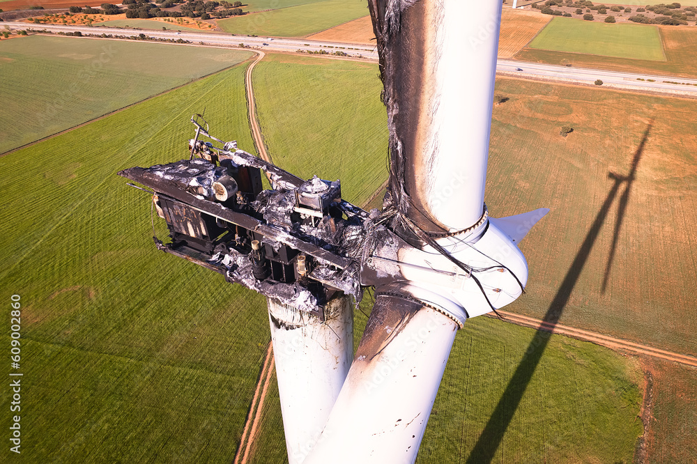 Elevated front view of a Burned-Out windmill in a wind farm. Close-up ...