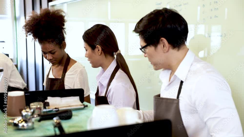 Group of multi-ethnic people working in cafeteria, trainees practice ... Group of multi-ethnic people working in cafeteria, trainees practice ...