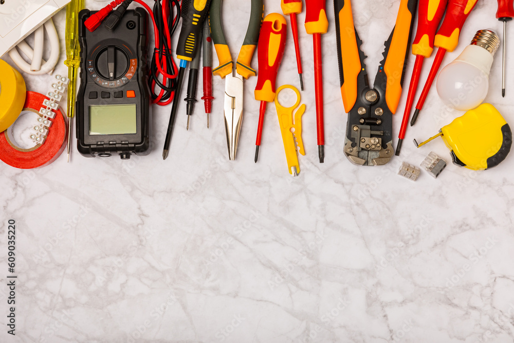 Electrician equipment on marble background with copy space.Top view ...