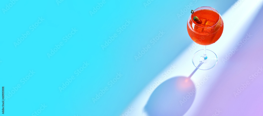 Classic italian aperol spritz cocktail over gradient blue neon ...