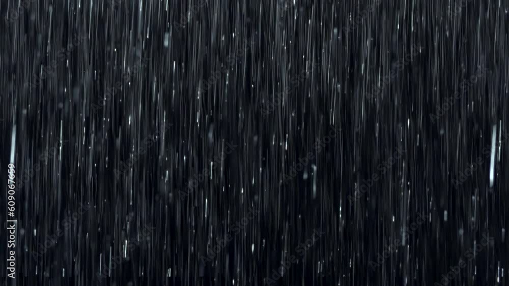 Heavy rain wall falling in front of the camera against black screen in ...