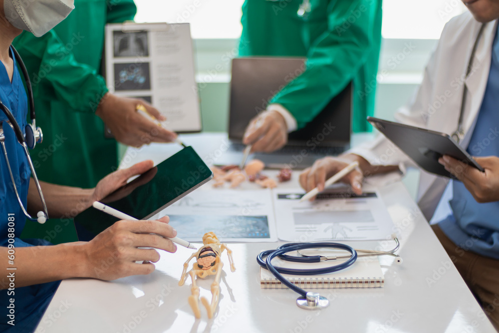 Medical team meeting with surgical surgeon in white coats and surgical ...
