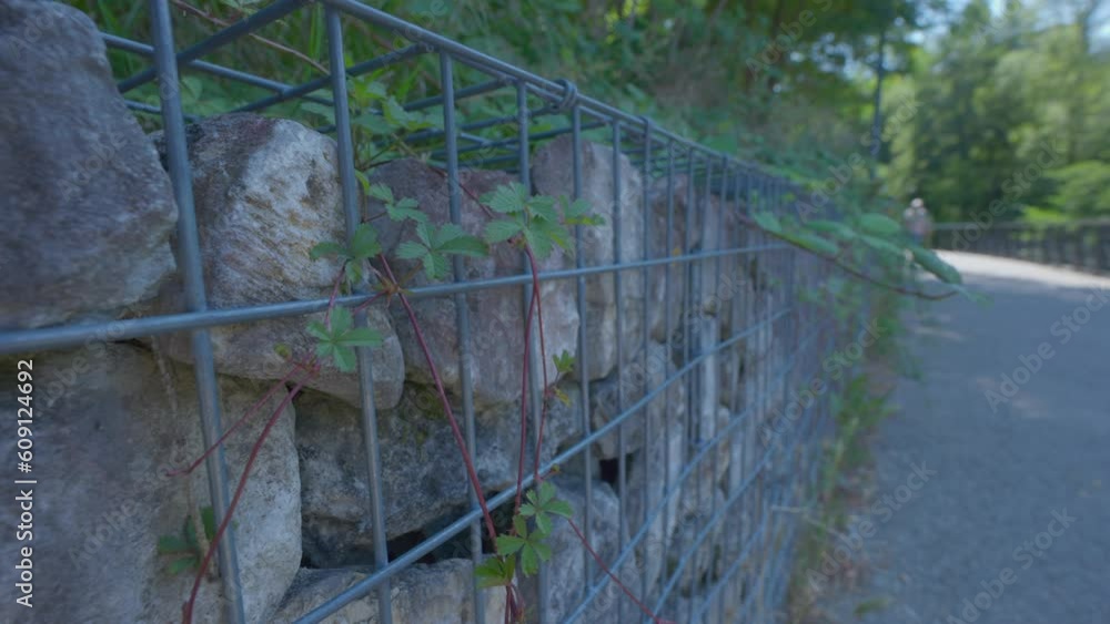 Wire Gabion Rock Fence. Stone wall texture rocks behind metal grid ...