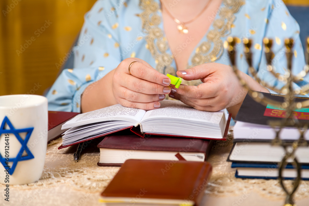 A Jewish female Torah teacher gives a lesson to women in the synagogue ...