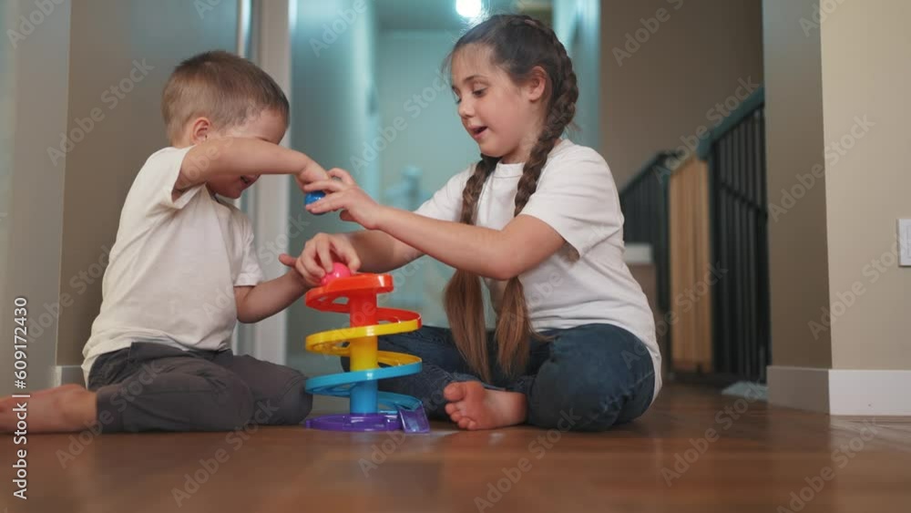 children baby play together toys in kindergarten. happy family ...